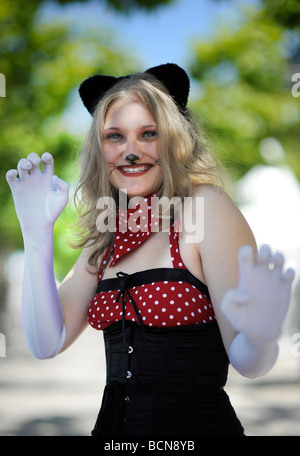 Germany, Duesseldorf, happy young woman with headphones at Rhine ...