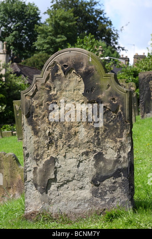An unsafe headstone in a churchyard Stock Photo - Alamy
