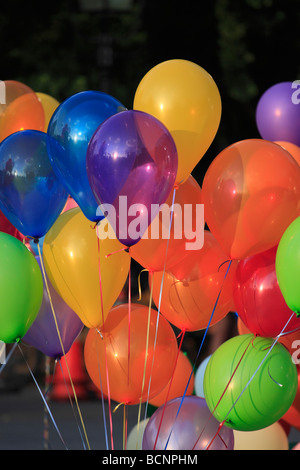 Helium balloons tied to a string Stock Photo - Alamy