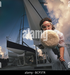 Women holding polishiing buffer in the air Stock Photo - Alamy