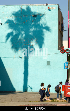 kid's shadows on wall. shadow of two children, boy and girl on striped ...