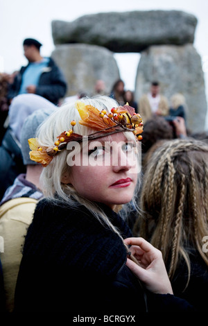 A reveller at the ancient stone circle Stonehenge to celebrate the ...