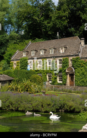 Swan Inn and River Coln Bibury Gloucestershire England UK Stock Photo ...