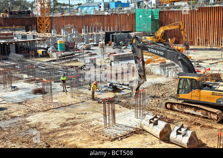 Constructing the concrete and steel foundations for a highrise building ...