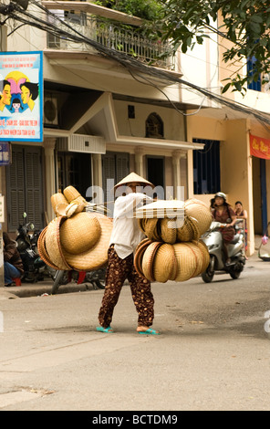 Street hawker is walking with carry bamboo baskets of grilled eggs on ...