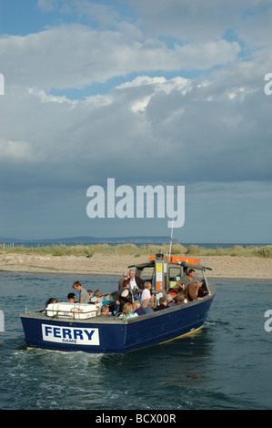 Mudeford ferry crossing from the quay to sandbank Stock Photo - Alamy
