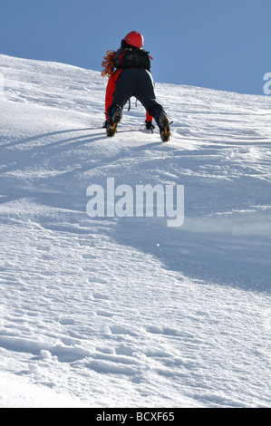 Alpinist man with ice climbing equipment on a frozen waterfall Stock ...