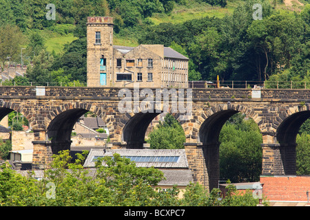Slaithwaite mill and railway viaduct in the Colne Valley, West ...
