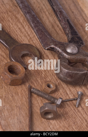 Old wrench and nut on a rusty countertop Stock Photo - Alamy