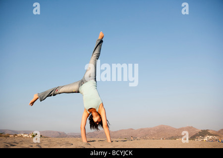 woman turning a cartwheel Stock Photo - Alamy