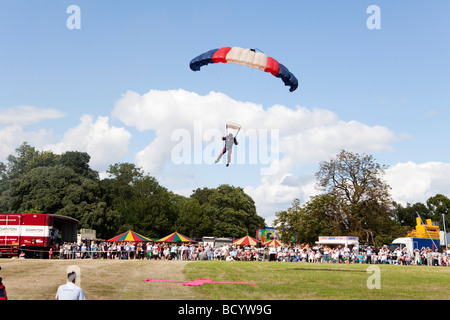 A parachutist from the Royal Navy Raiders Parachute Display Team ...