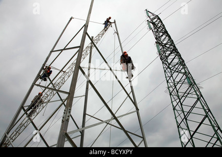 Italian ENEL Electric company power crew stringing high capacity wires ...