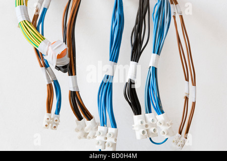 A close-up shot of a variety of electrical cables, cords, and wires ...