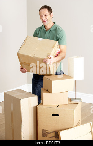 Man moving house with boxes Stock Photo - Alamy