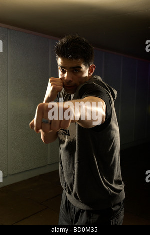 Man throwing punch Stock Photo - Alamy