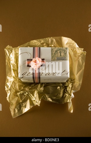 Gift or present being unwrapped Stock Photo - Alamy