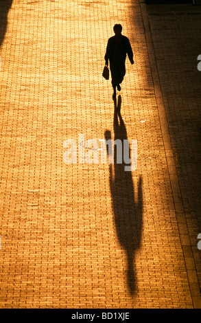 A walking woman casts a shadow on a wall in Santiago de Cuba Stock ...
