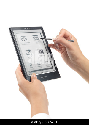 Woman using Sony Reader. PRS-700 Portable Reader System. Touch screen e ...