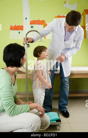 Pediatrician measure height of young girl at medical office Stock Photo ...