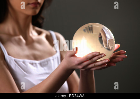 Chinese girl holding crystal ball,China Stock Photo - Alamy