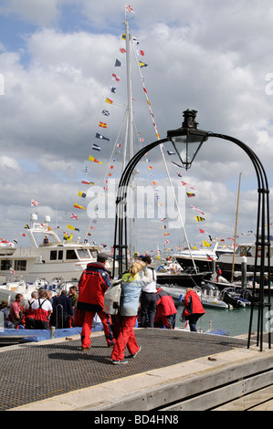 Cowes regatta week visiting sailors yachtsmen on the RYS landing stage ...
