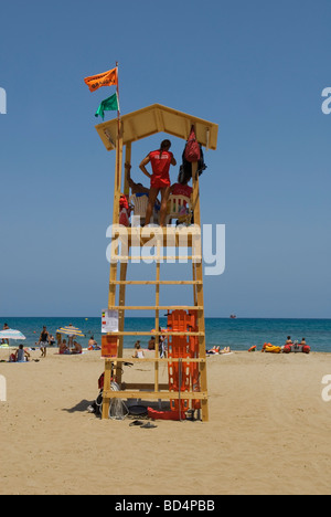 Lifeguard Look out Tower at Ocean Edge on Beach Stock Photo - Alamy