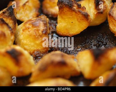 Freshly cooked roast potatoes just out of the oven Stock Photo - Alamy