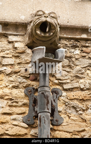 A rain gutter, drain pipe with a gargoyle, Paris, France Stock Photo ...