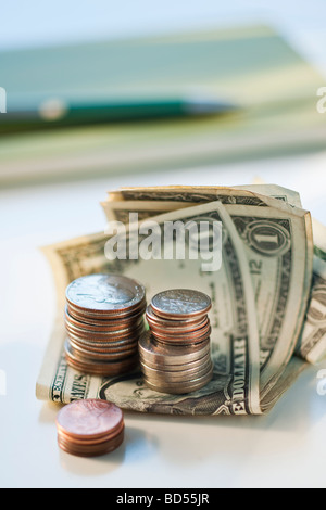 Coins and currency notes Stock Photo - Alamy