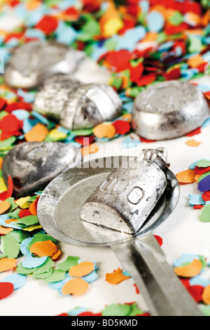 Pouring molten lead on New Year's Eve Stock Photo - Alamy