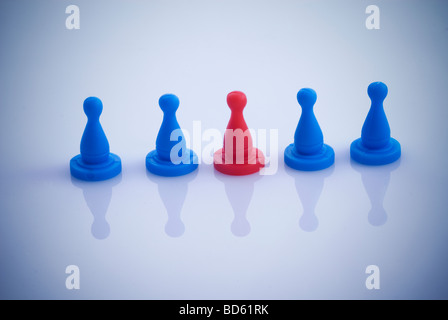 Red and blue playing counters ( standing out from the crowd concept ...