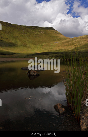 The lake of Llyn Lluncaws, below Cadair Berwyn in the Berwyn mountains ...