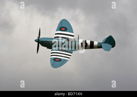 A Vickers Supermarine Spitfire PR9 of the RAF against dark menacing ...