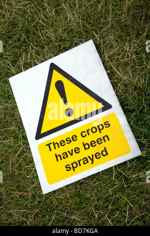 Sign warning of sprayed crops in a Kentish orchard Stock Photo - Alamy