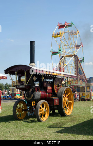 Showmans Traction Engine and fairground ride at a steam fair in England ...
