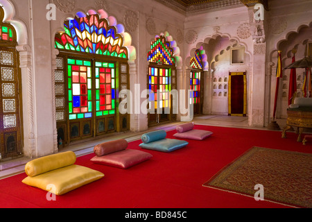 Gaudy room in the palace at Jodhpur with carved stonework and coloured ...