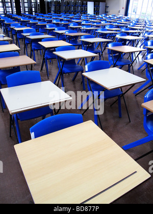 Rows of empty school exam desks in exam room hall Stock Photo - Alamy