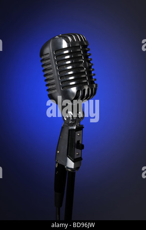 Blue stage with microphone and spotlight Stock Photo - Alamy