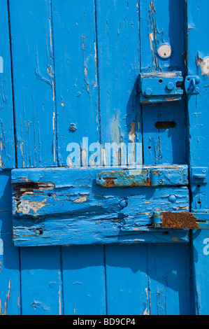 A close of an old, rotting wooden door with multicoloured layers of peeling paint Stock Photo ...