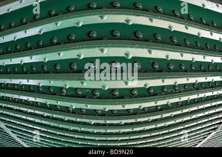 Steel beams on a railway bridge with steel plates and riveted ...