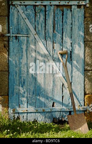 Peeling red paint on a cottage front door near Llanberis, Snowdonia ...