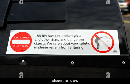 Signs on communal bins in Brighton warning people not to climb in Stock ...