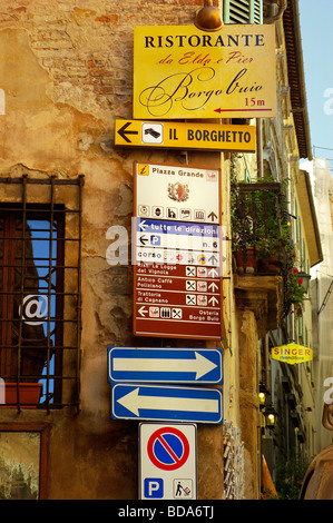 Confusing road signs in Italy Stock Photo - Alamy