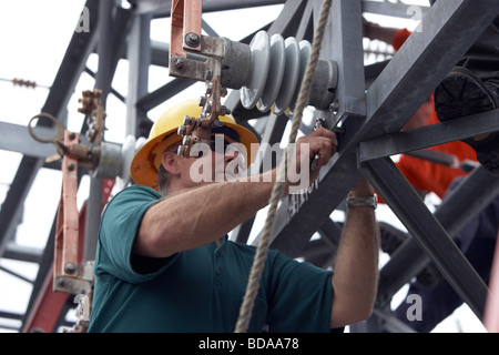 Utility workman installing updated components to a "city gate ...