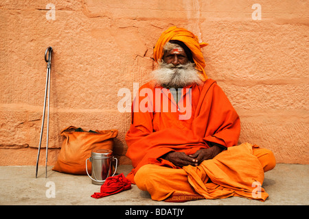 Sadhu or holy man sitting with his hands folded in prayer on the ...