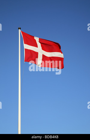 The flag of Denmark, Dannebrog, is red with a white Scandinavian cross ...