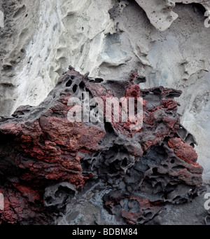 Iron-rich deposits in the volcanic rock give the coast of Bartolome a ...