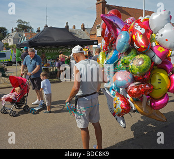 Balloon seller at local event Stock Photo - Alamy