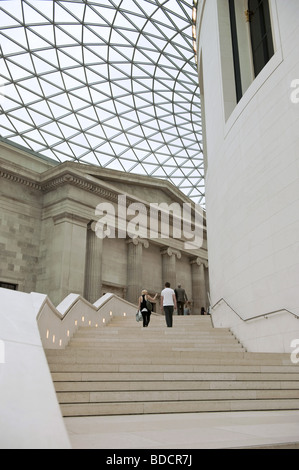 Interior glass roofed central atrium with exhibition banners inside the ...