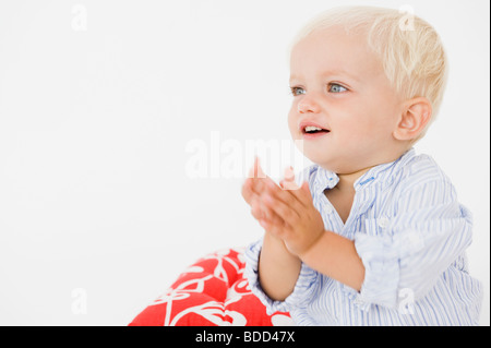 Baby boy clapping Stock Photo - Alamy